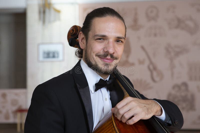 Young Man Playing the Cello. Portrait of the Cellist Stock Photo ...