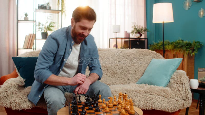 Young Man Playing Chess Alone Making Serious Move Deep Thinking ...