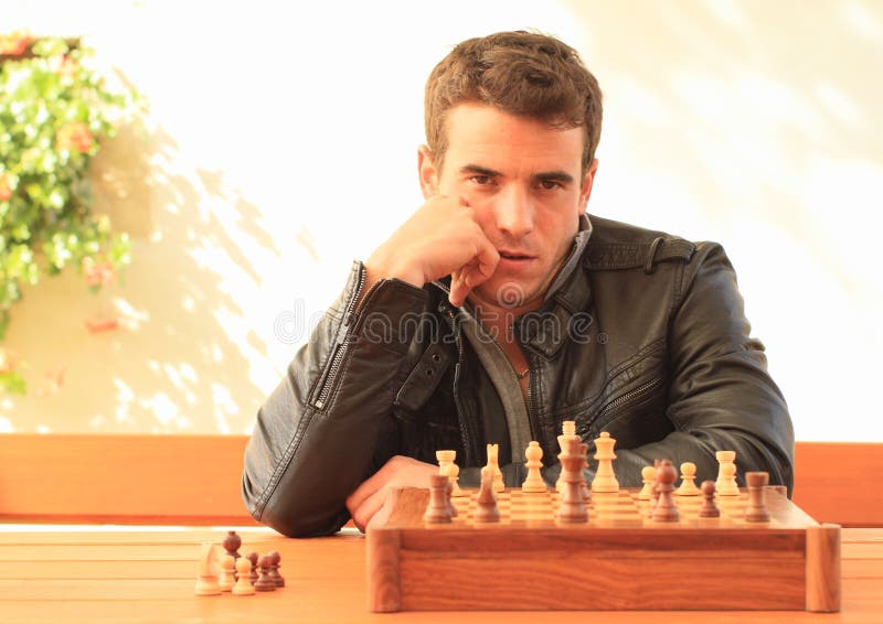 Young man playing chess stock image. Image of thinking - 34046309