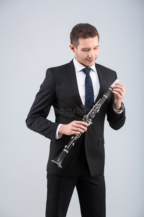 Young Man Playing the Clarinet Stock Photo - Image of person, classical ...