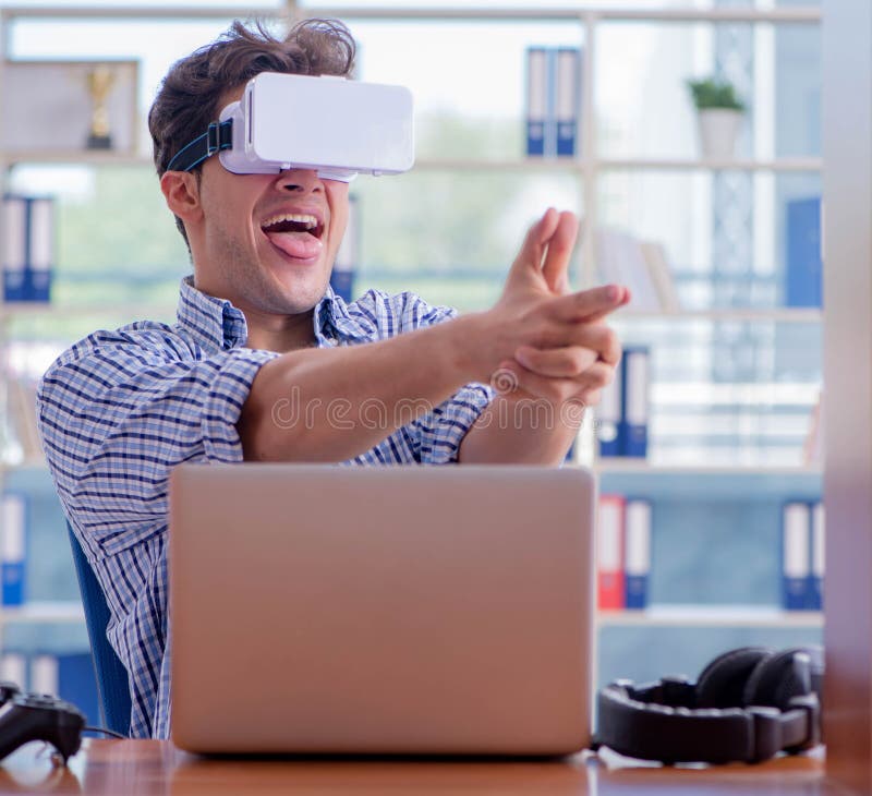 Young Man Playing Computer Game with Virtual Reality Glasses Stock ...