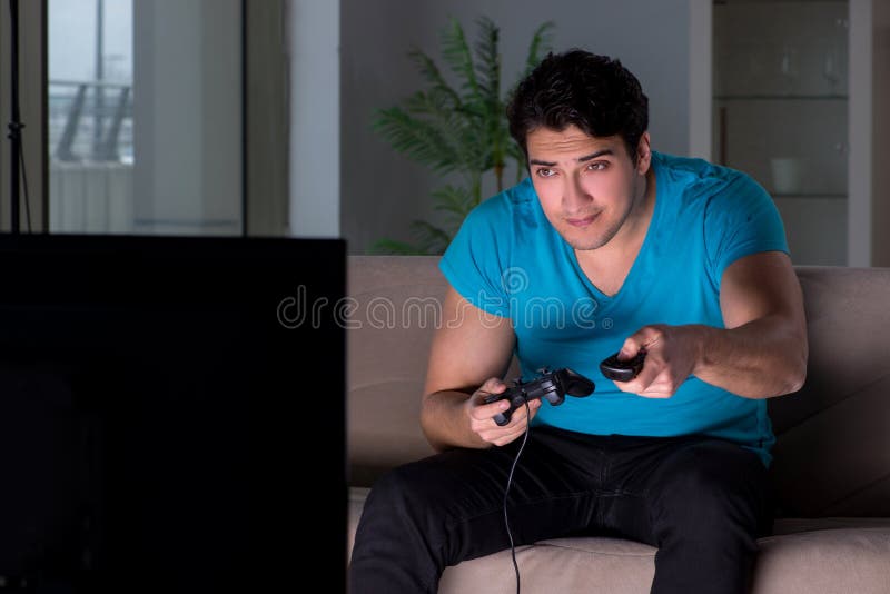The Young Man Playing Computer Games Late at Night Stock Photo - Image ...