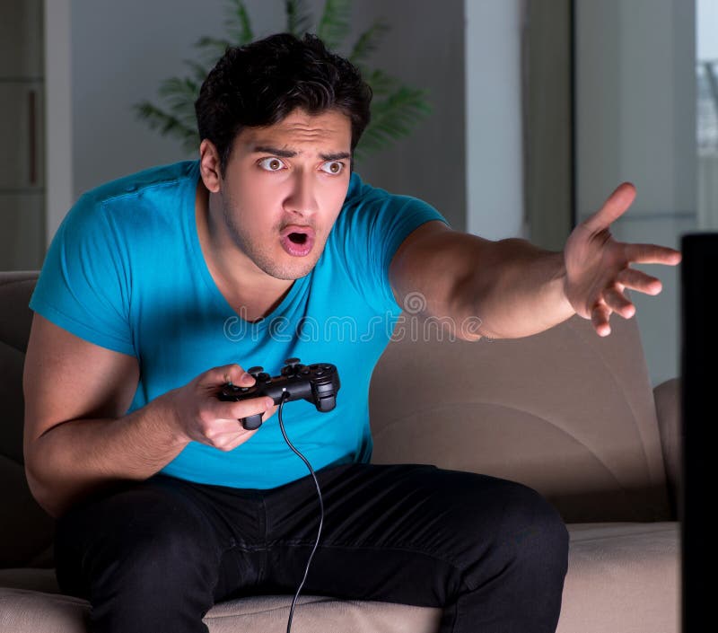 Young Man Playing Computer Games Late at Night Stock Image - Image of ...