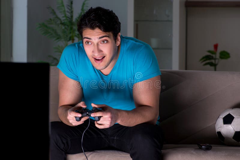 The Young Man Playing Computer Games Late at Night Stock Photo - Image ...