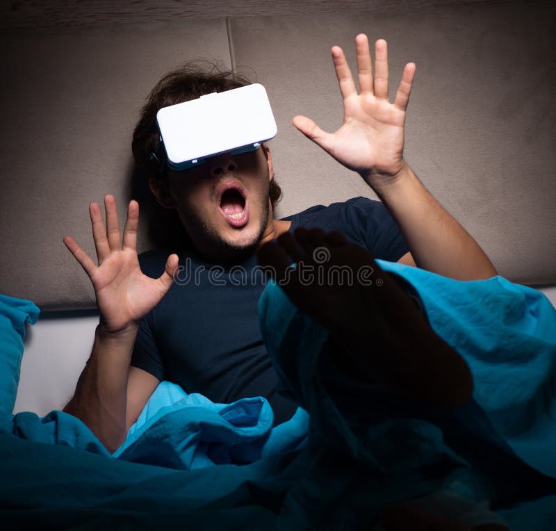 Young Man Playing Computer Games at Night in Bed Stock Image - Image of ...