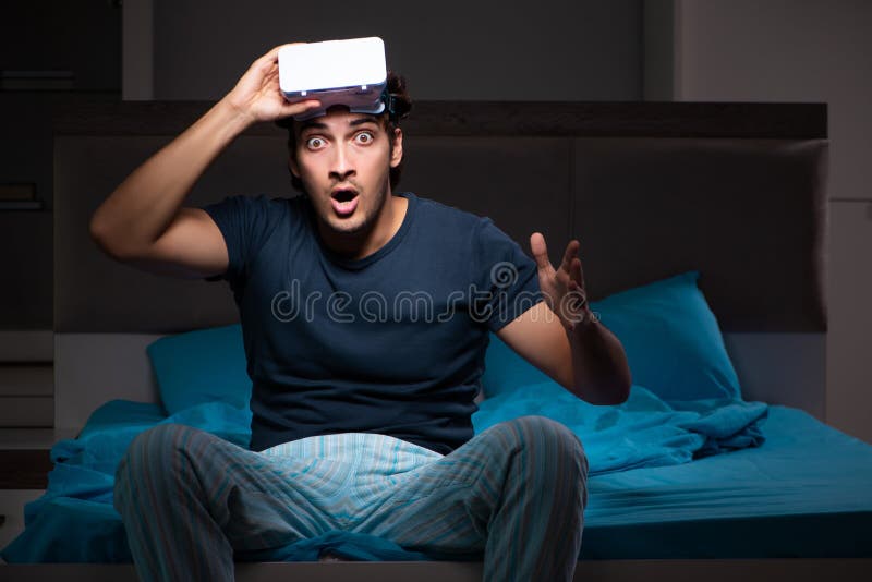 The Young Man Playing Computer Games at Night in Bed Stock Image ...