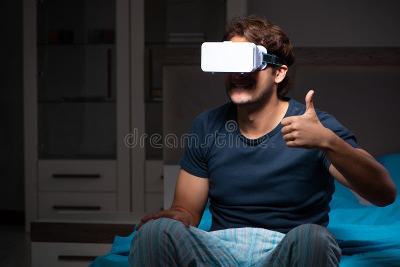 The Young Man Playing Computer Games at Night in Bed Stock Image ...