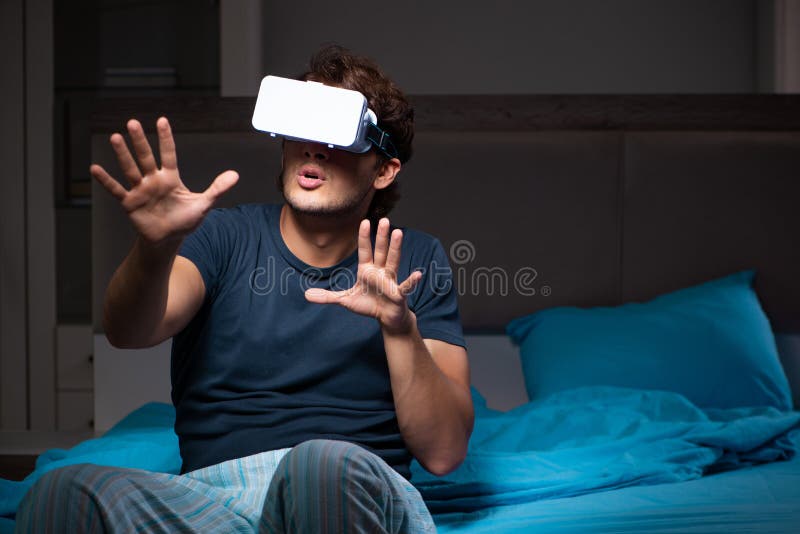 The Young Man Playing Computer Games at Night in Bed Stock Photo ...
