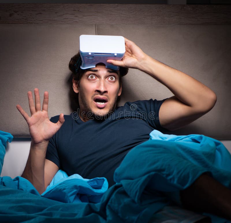 Young Man Playing Computer Games at Night in Bed Stock Image - Image of ...
