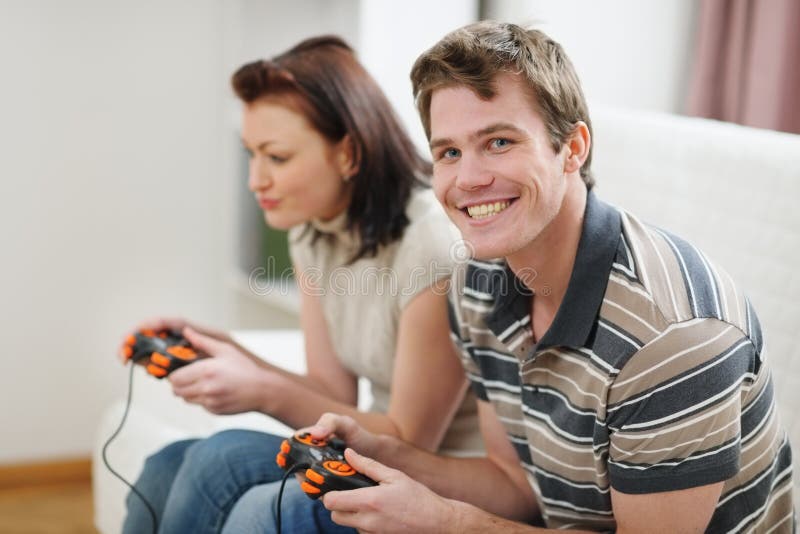 Young Man Playing on Console with Girlfriend Stock Image - Image of ...