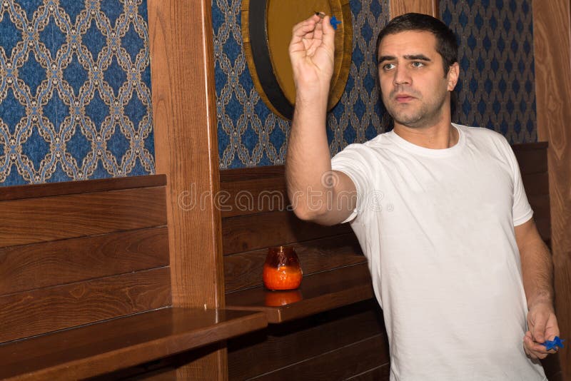 Young Man Playing Darts in a Club Stock Image - Image of caucasian ...