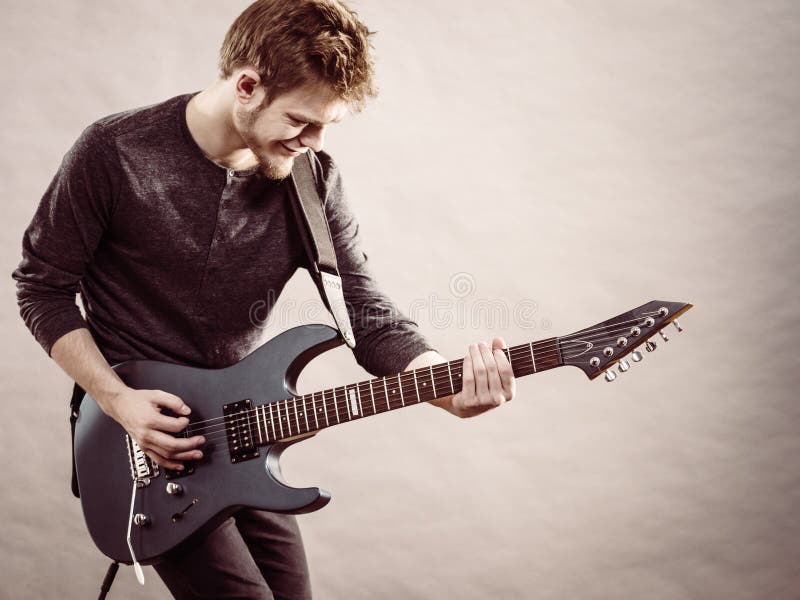 Young Man Playing Electric Guitar Stock Photo - Image of music ... Young Man Playing Electric Guitar Stock Photo - Image of music ...