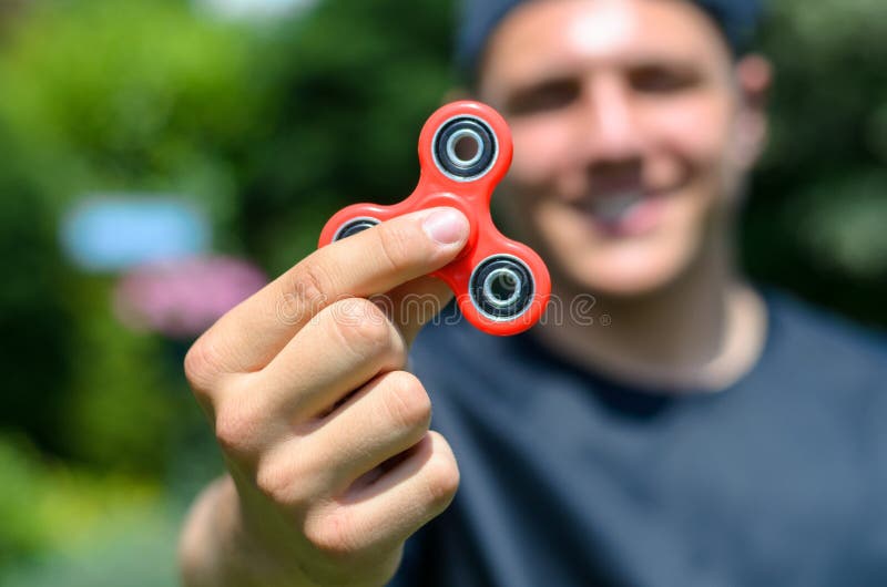 Young Man Playing with a Fidget Spinner Stock Image - Image of game ...