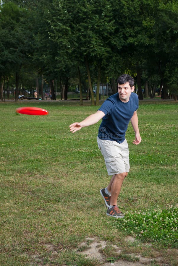 Young Man Playing Frisbee Outdoors Stock Image - Image of people ...