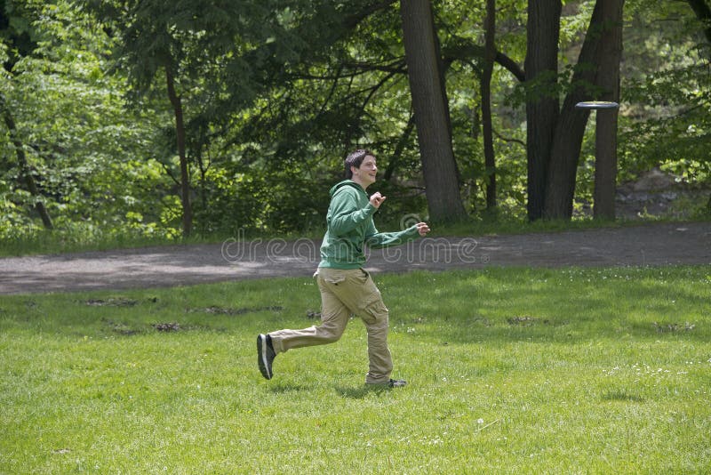 Young Man Playing Frisbee at the Park Stock Photo - Image of teen ...