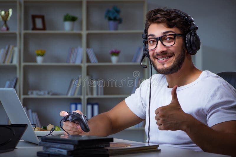 The Young Man Playing Games Long Hours Late in the Office Stock Image ...