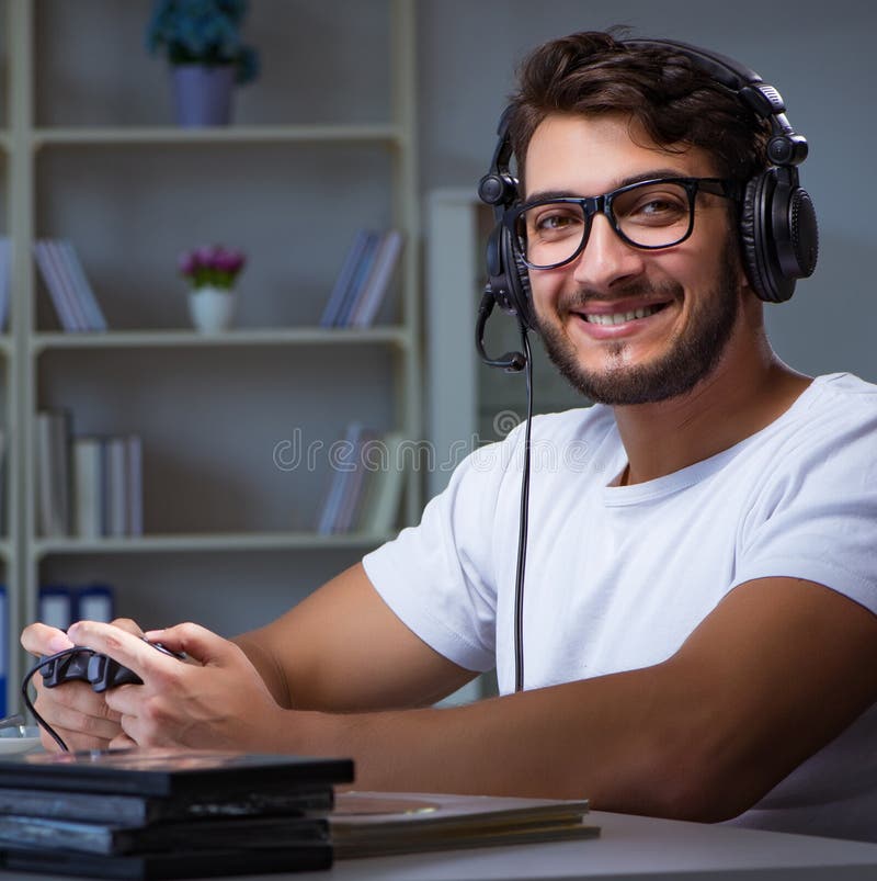 Young Man Playing Games Long Hours Late in the Office Stock Photo ...