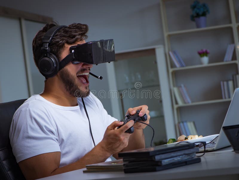 The Young Man Playing Games Long Hours Late in the Office Stock Image ...
