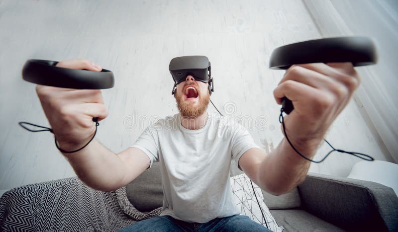 The Young Man Playing Games with Virtual Reality Goggles Stock Image ...