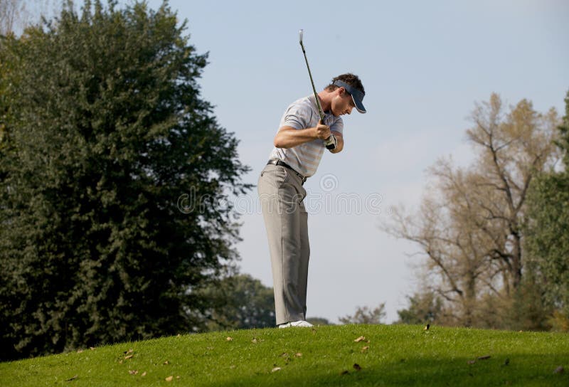 Young man playing golf stock image. Image of activities - 53698027