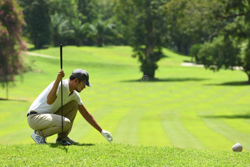 Young Man Playing Golf on a Beautiful Natural Golf Course Stock Photo ...
