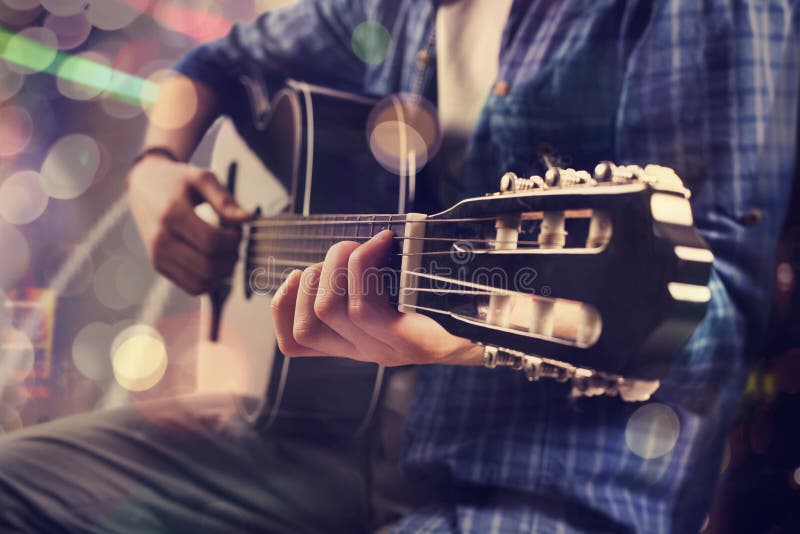 Young man playing guitar stock photo. Image of guitarist - 69584534