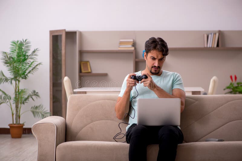 Young Man Playing Joystick Games at Home Stock Image - Image of gamepad ...