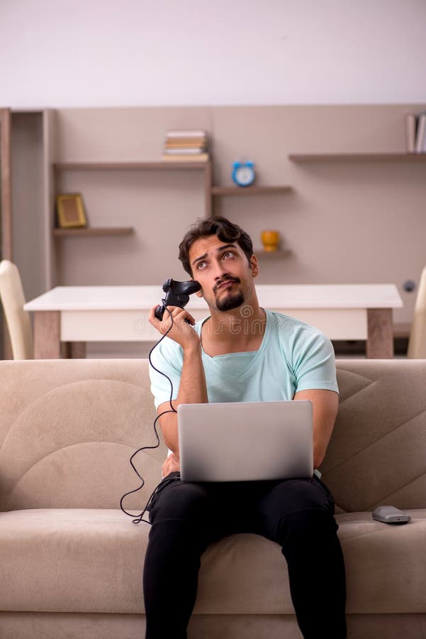 Young Man Playing Joystick Games at Home Stock Image - Image of ...