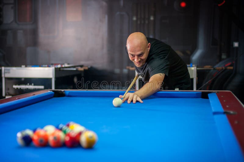 Young Man Playing Pool Game in Pub Stock Photo - Image of blue ...