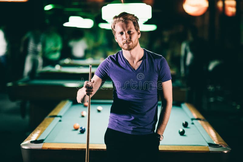 Young man playing pool stock photo. Image of enjoyment - 53710890