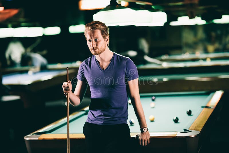 Young man playing pool stock image. Image of enjoyment - 56524719