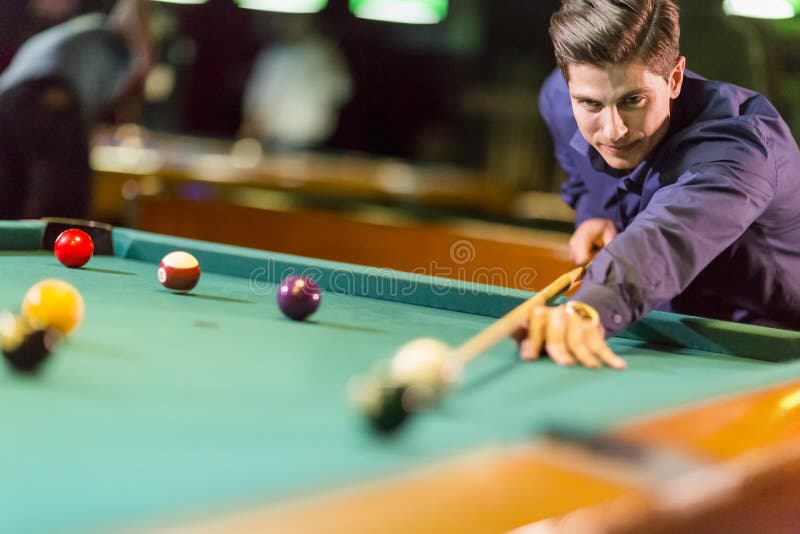Young man playing pool stock image. Image of billiard - 54046299