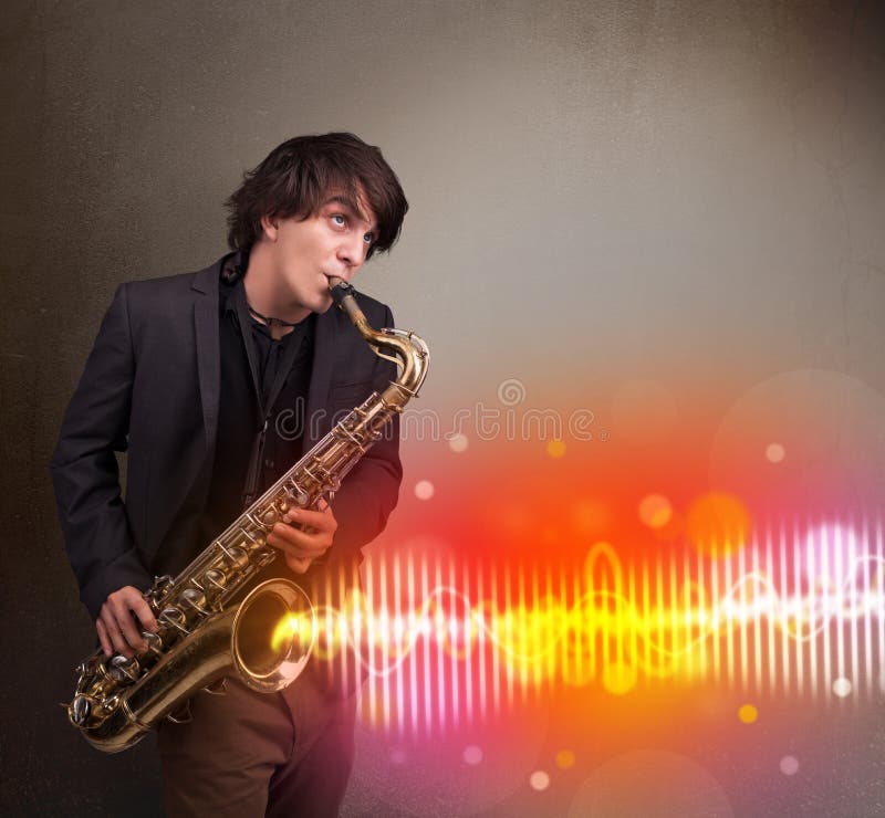 Young Man Playing on Saxophone with Colorful Sound Waves Stock Photo ...