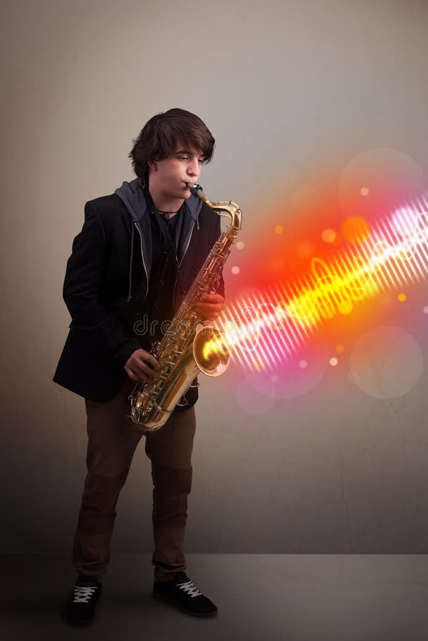 Young Man Playing on Saxophone with Colorful Sound Waves Stock Image ...