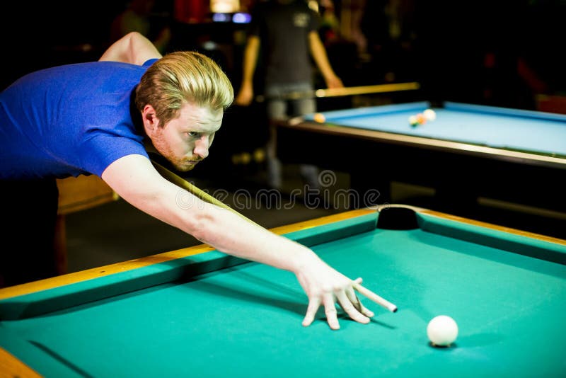 Young man playing snooker stock image. Image of caucasian - 64182479
