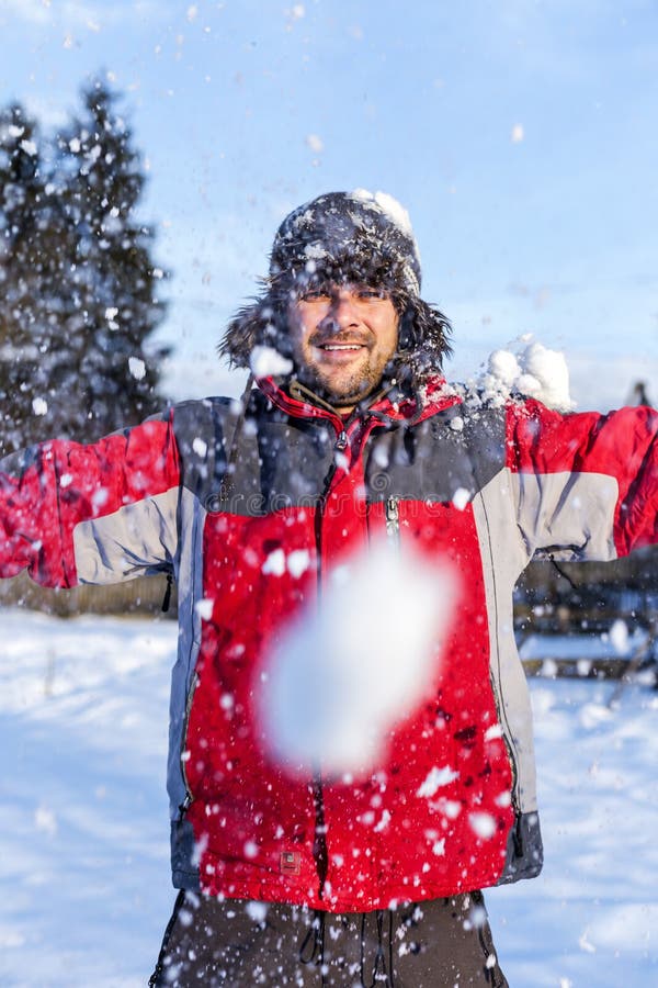 Young Man Playing with Snow Stock Image - Image of healthy, lifestyle ...