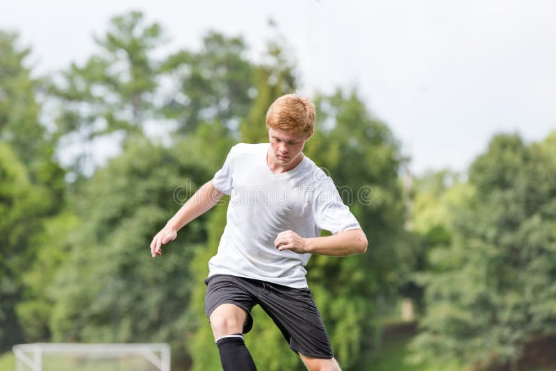 Young Man Playing Soccer - Doing a Soccer Move Stock Photo - Image of ...