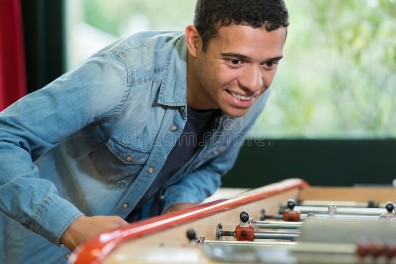 Young Man Playing Table Football Stock Photo - Image of goalkeeper ...