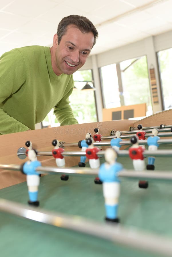 Young Man Playing Table Football Stock Image - Image of pursuit ...
