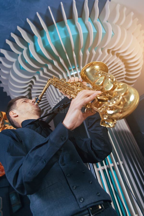 Young Man Plays a Musical Instrument Saxophone Stock Photo - Image of ...