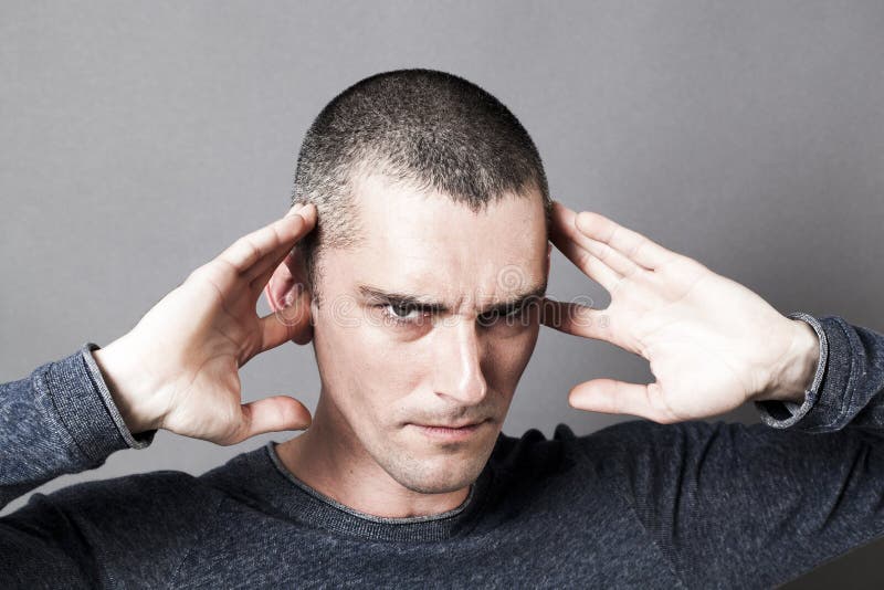 Young Man Plugging Ears To Avoid Listening To Problems Stock Image ...
