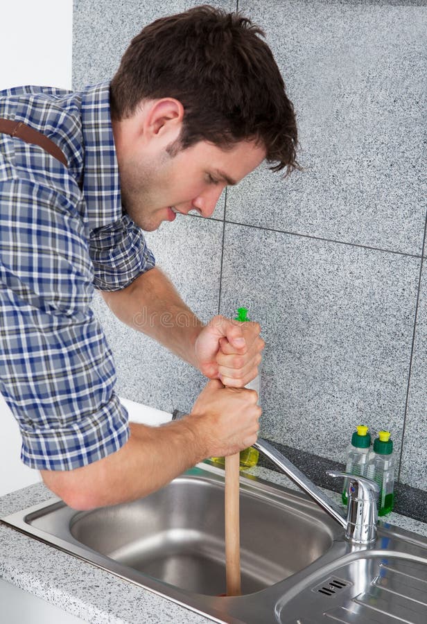Young Man with Plunger stock image. Image of cleaner - 35319381
