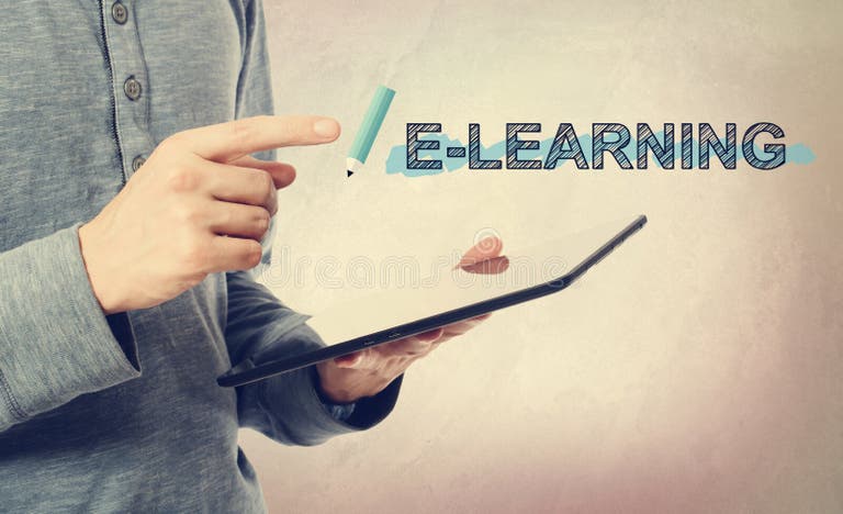Young Man Pointing at E-Leaning Text Over Tablet Computer Stock Image ...