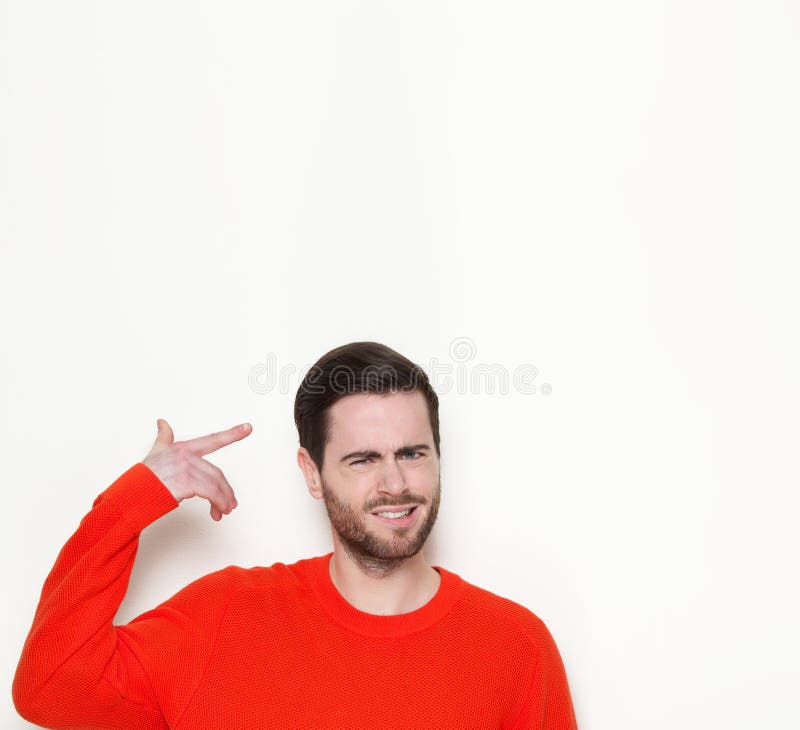 Young Man Pointing Finger To Head Stock Photo - Image of cool, gesture ...