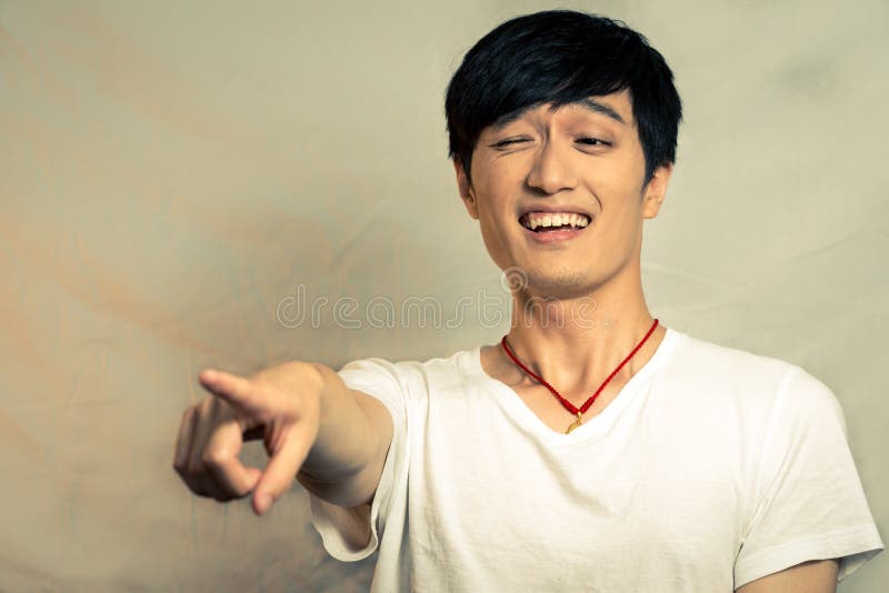Young Man Pointing and Laughing Stock Image - Image of background ...