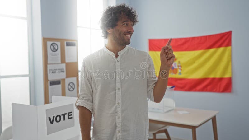 Young Man Pointing at Something Inside a Spanish Electoral College ...