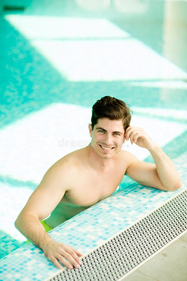 Young man in the pool stock image. Image of edge, beauty - 53437831