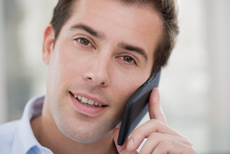 Handsome Man on the Mobile Phone in Hall Station Stock Image - Image of ...