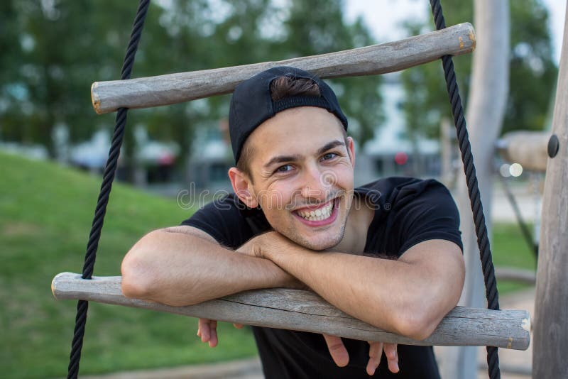 Young Man Portrait on the Playground in the Park. Stock Photo - Image ...