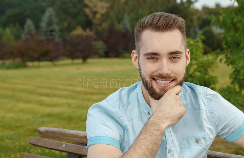 Young Man Posing on Park Bench Stock Photo - Image of male, hipster ...